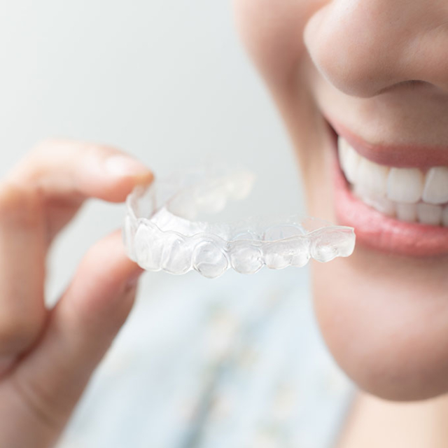 Why Choose a Clear Retainer Post-Braces? Top Benefits!
